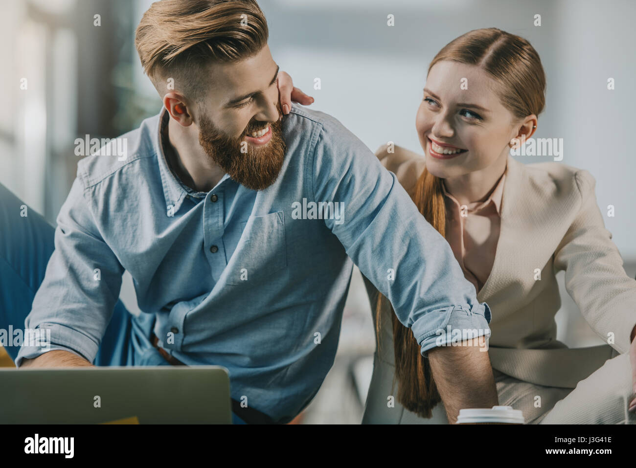 Happy young business people working together and smiling Stock Photo ...