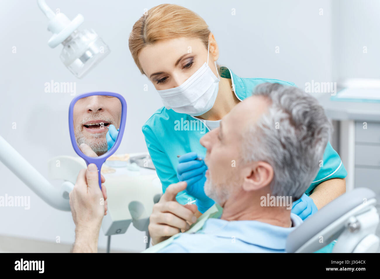 Doctor patient hand mirror hi-res stock photography and images - Alamy