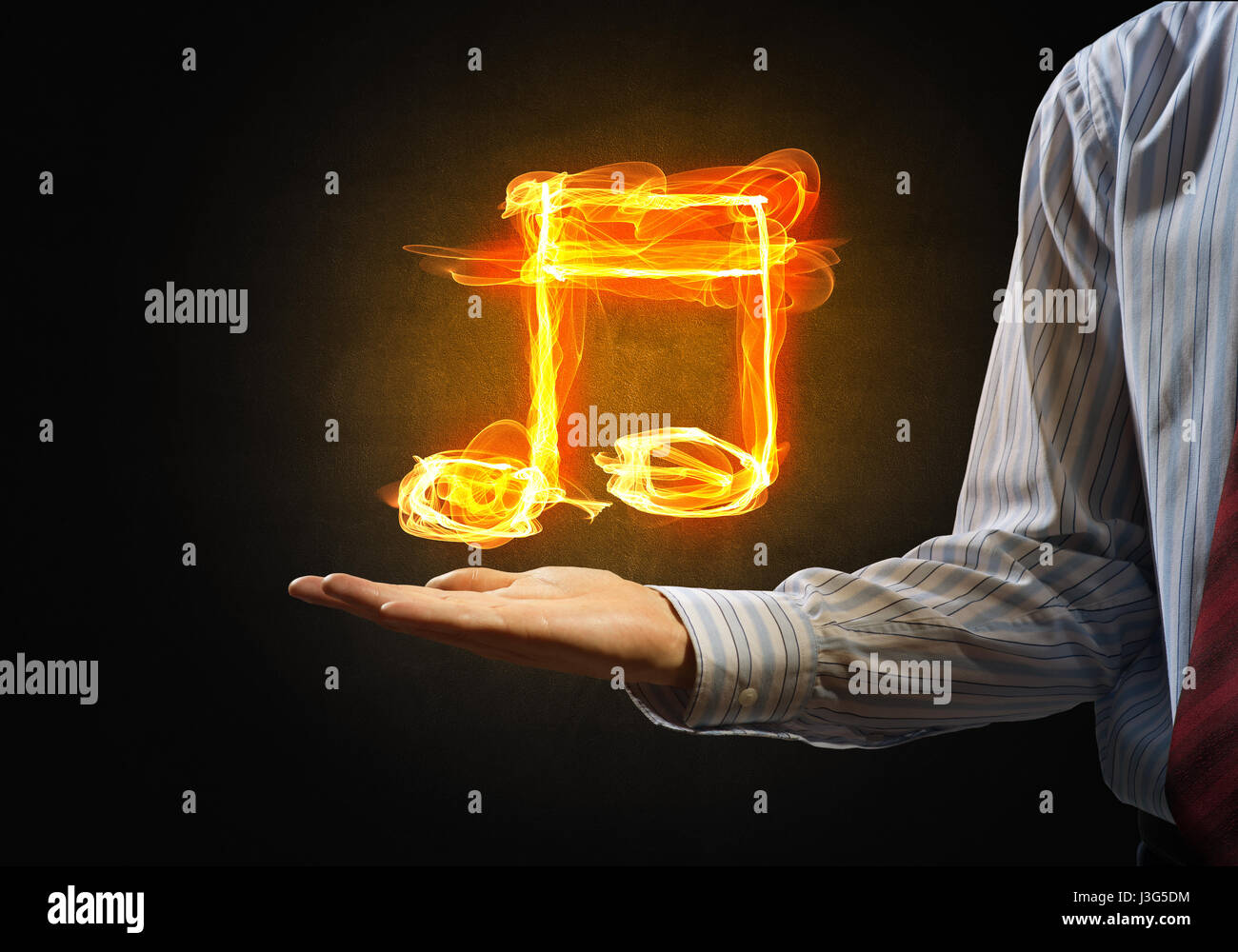 Close up of person hand holding fire music symbol Stock Photo - Alamy