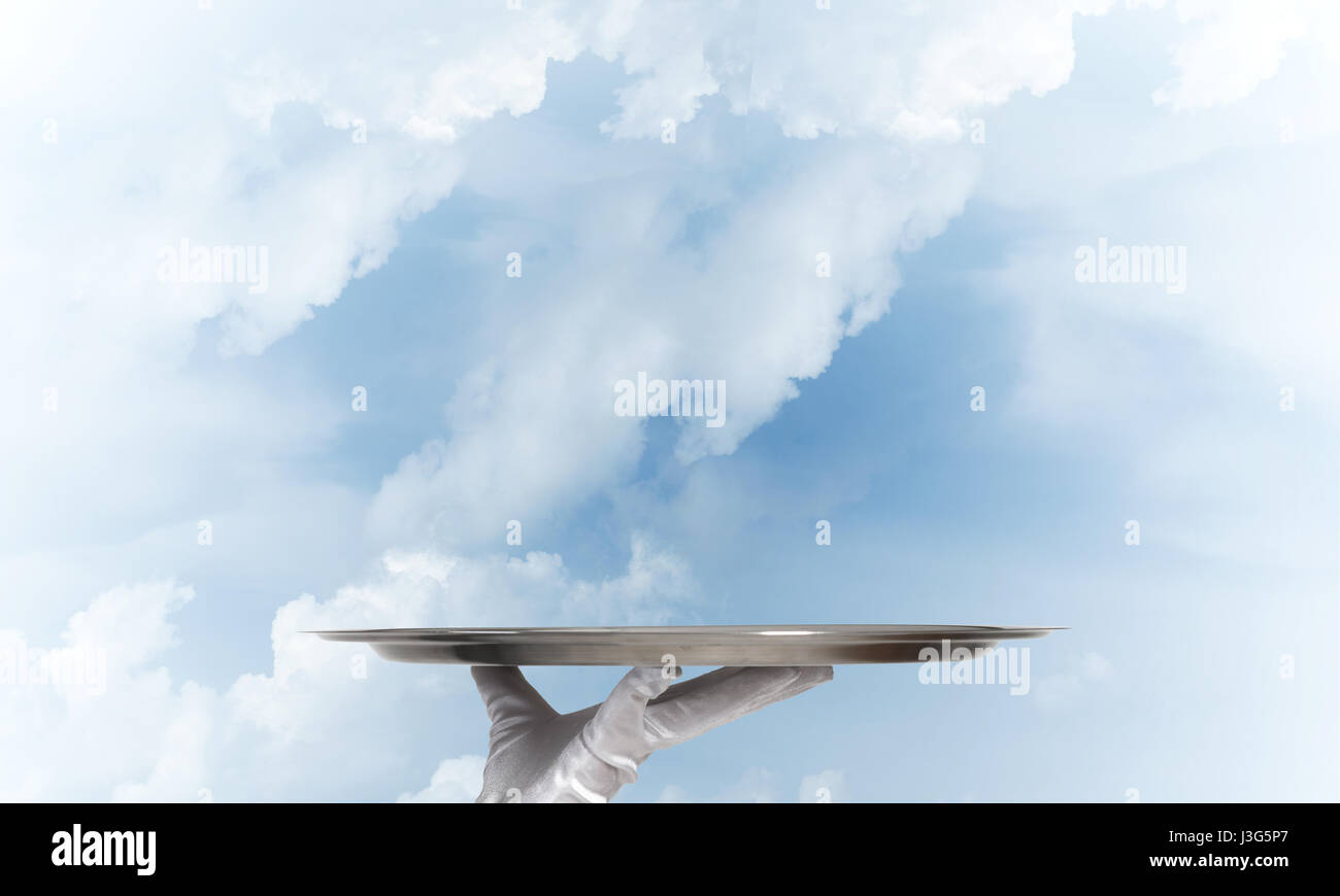 Butler hand in white glove presenting empty tray Stock Photo - Alamy