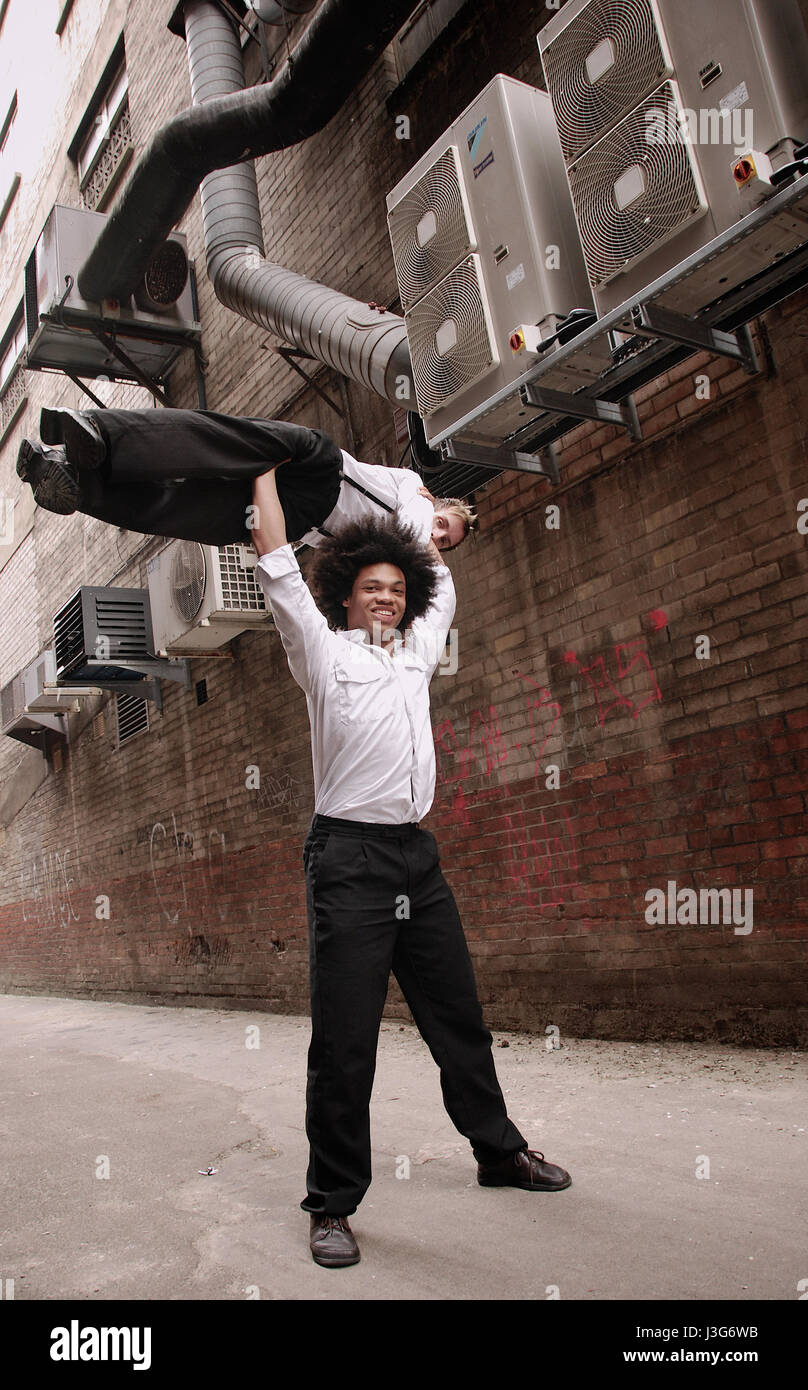 Man lifting model city hi-res stock photography and images - Alamy