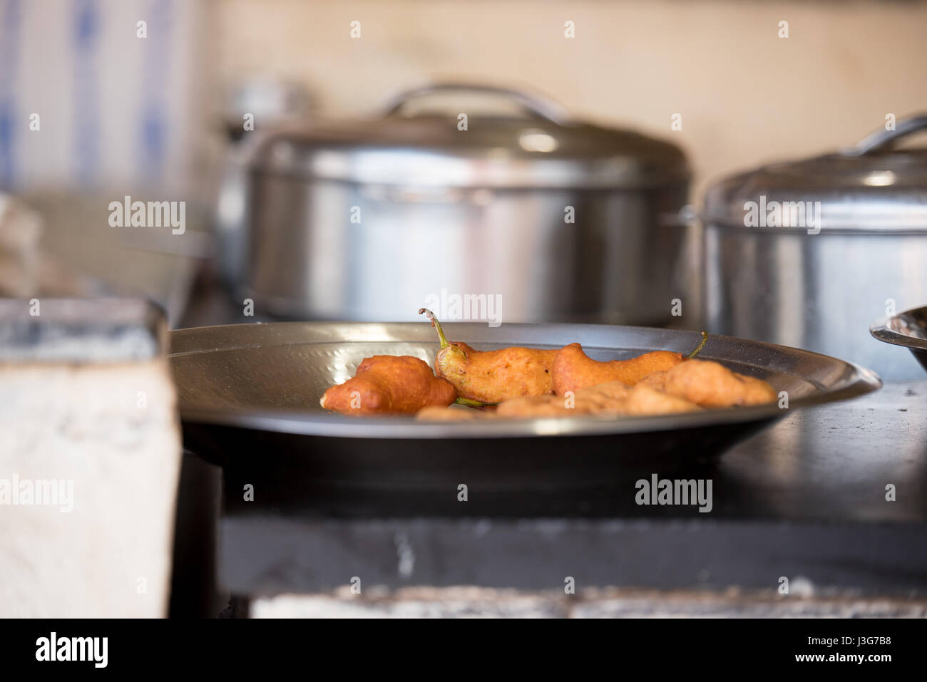 Food stand serving deep fried chili peppers in Kanyakumari, India Stock ...