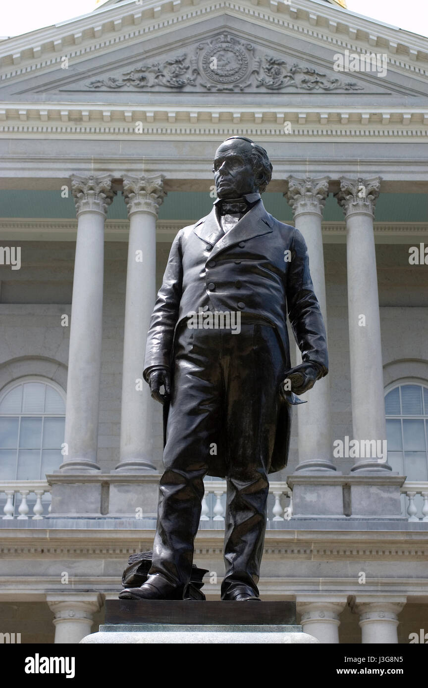 A statue of Daniel Webster in front of the New Hampshire State Capital ...