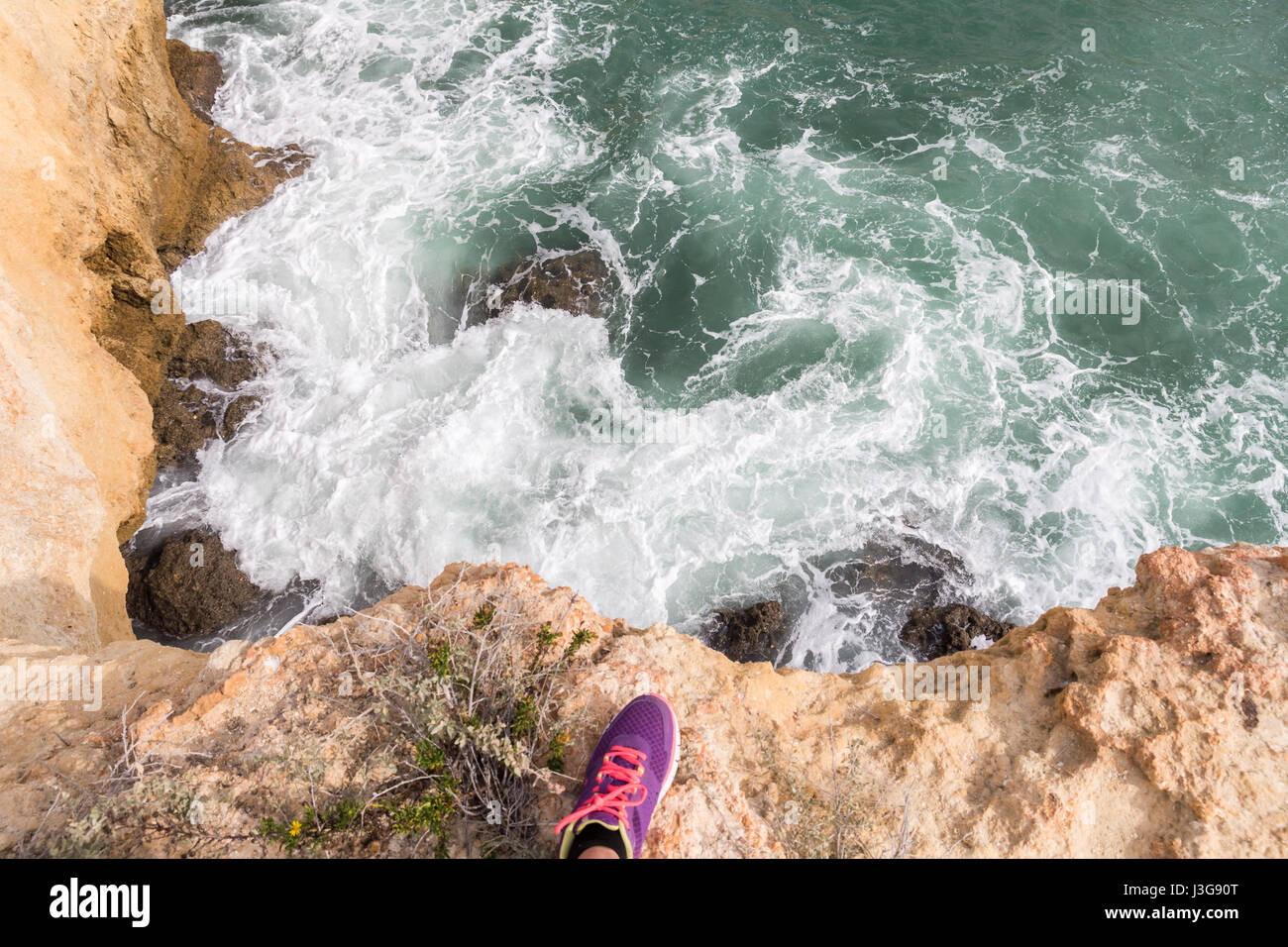 Standing on cliff edge hi-res stock photography and images - Alamy