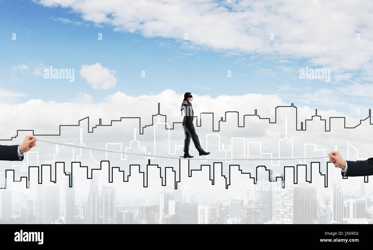 Business concept of risk support and assistance with man balancing on ...