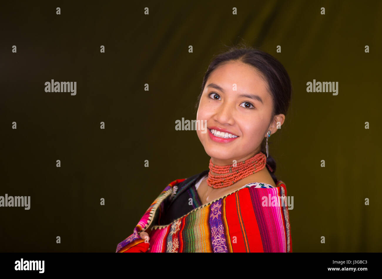 Beautiful Hispanic Model Wearing Andean Traditional Clothing Smiling