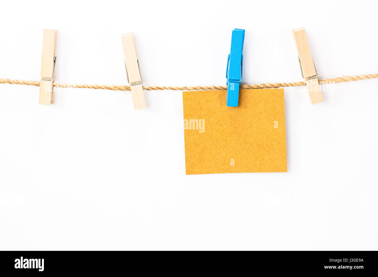 Notice card, white paper and wood clips on white background Stock Photo ...