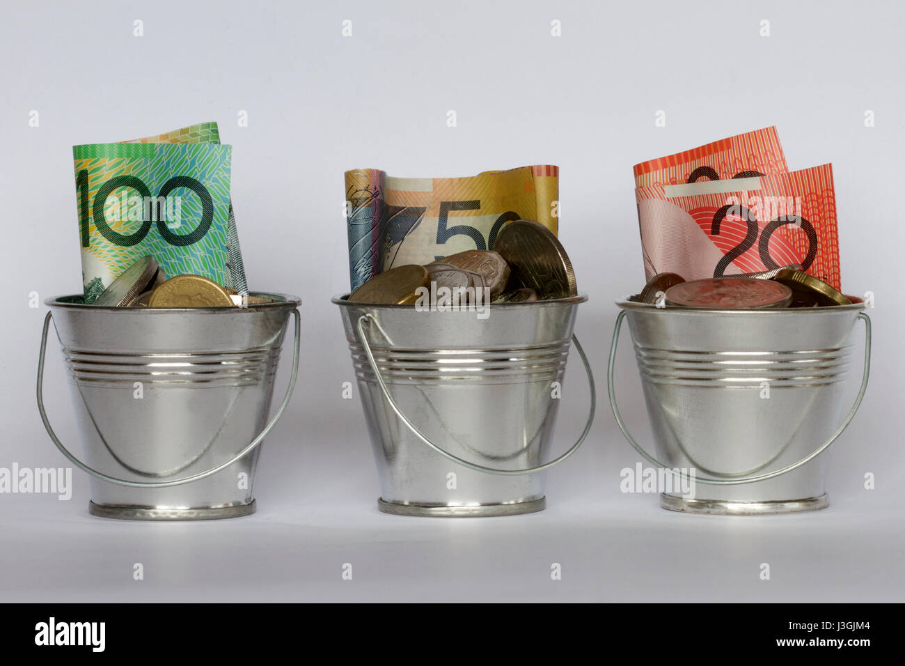 Three buckets of Australian money Stock Photo - Alamy