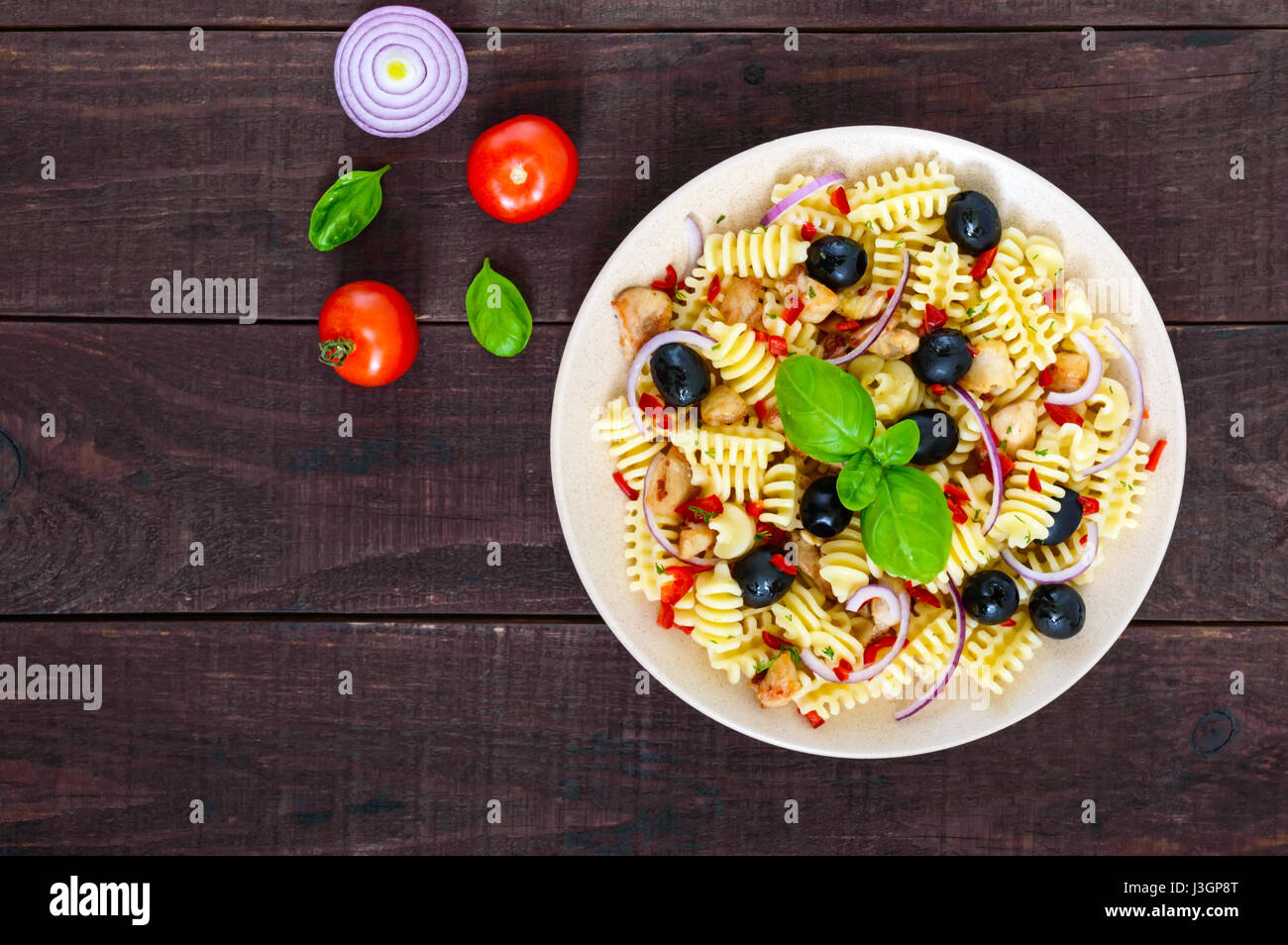 Pasta salad radiatori with chicken, black olives, blue onion, sweet ...