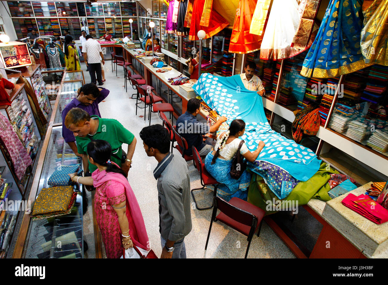 Shop selling colorful saris and fabrics at Mysore town, Karnataka ...