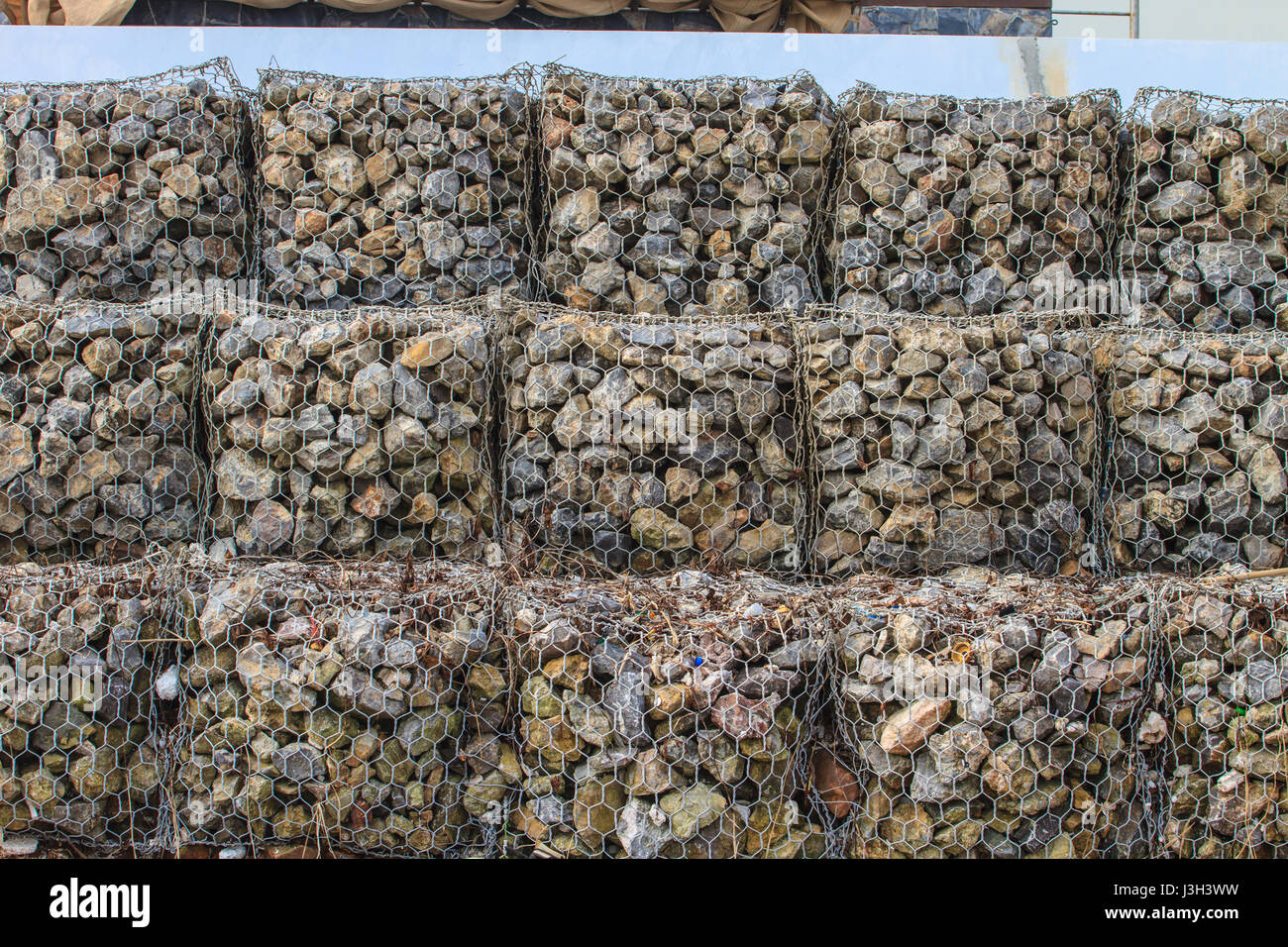 Rock breakwater, Cobble stone mole in sea Stock Photo - Alamy
