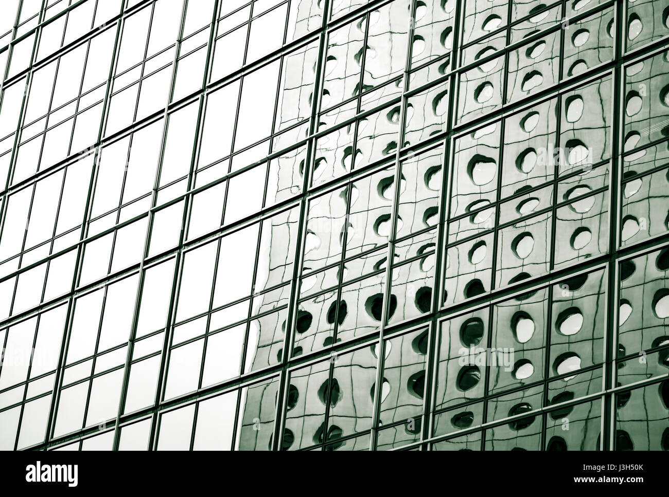 Modern office building detail, glass surface with green color Stock ...