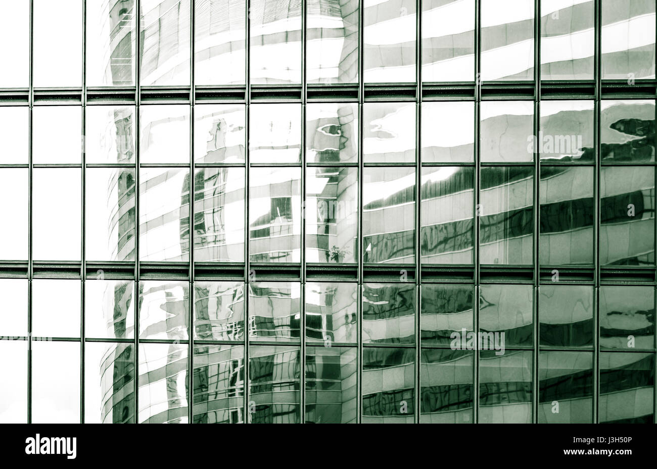 Modern office building detail, glass surface with green color Stock ...