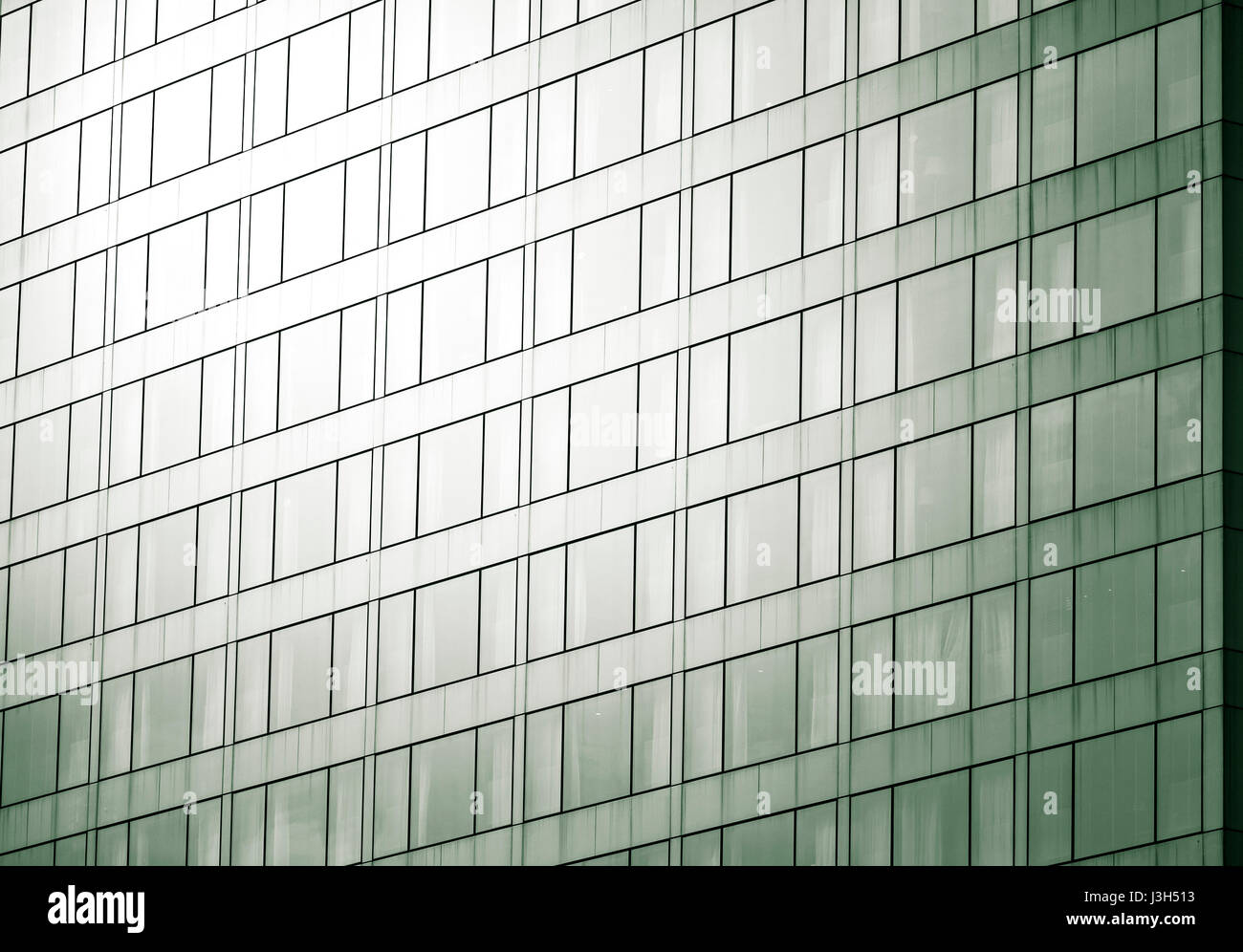 Modern office building detail, glass surface with green color Stock ...
