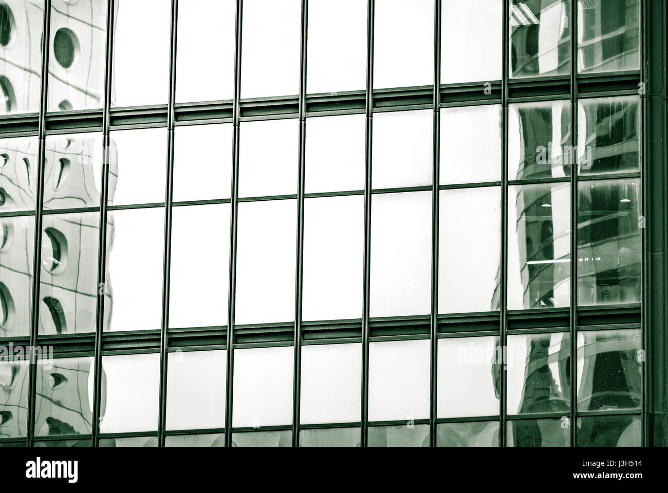 Modern office building detail, glass surface with green color Stock ...