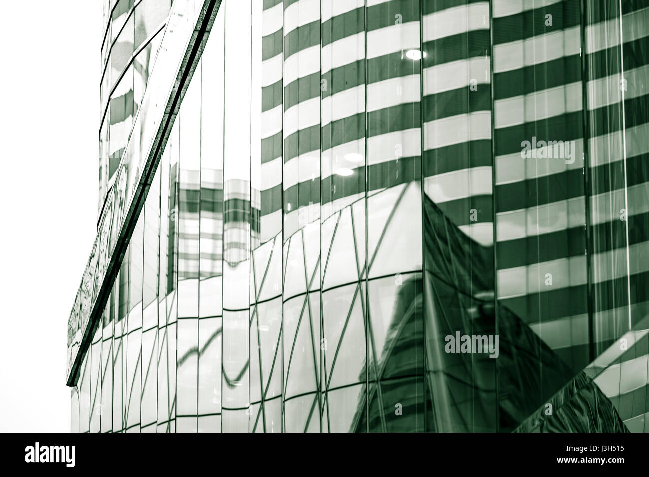 Modern office building detail, glass surface with green color Stock ...