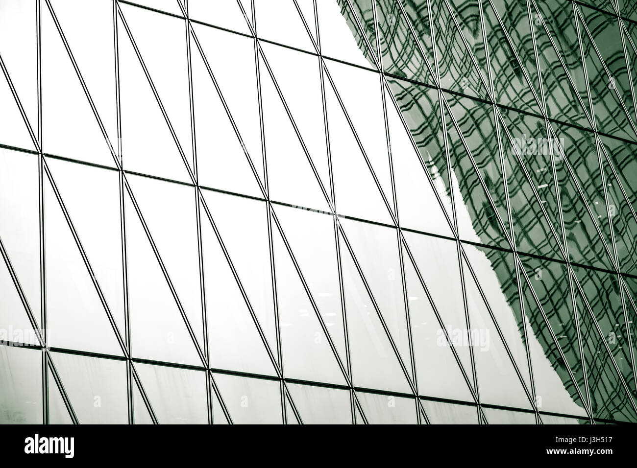Modern office building detail, glass surface with green color Stock ...