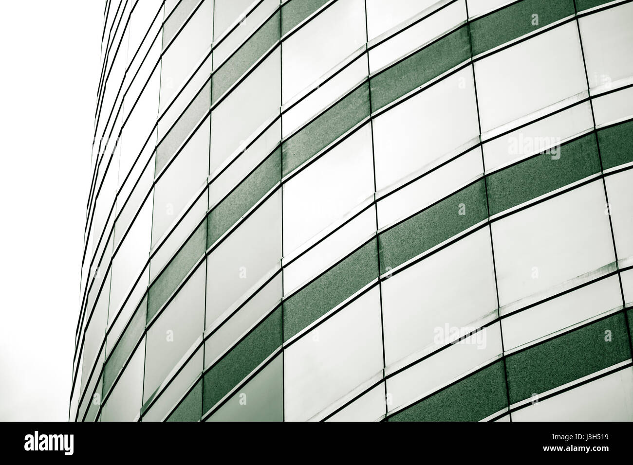 Modern office building detail, glass surface with green color Stock ...