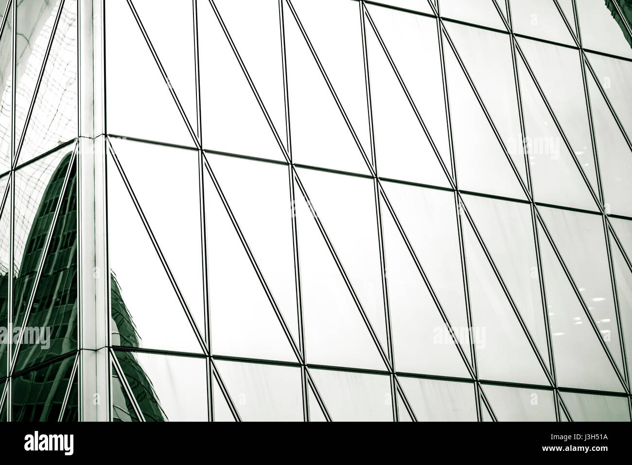 Modern office building detail, glass surface with green color Stock ...