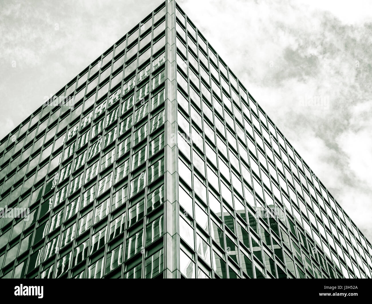 Modern office building detail, glass surface with green color Stock ...