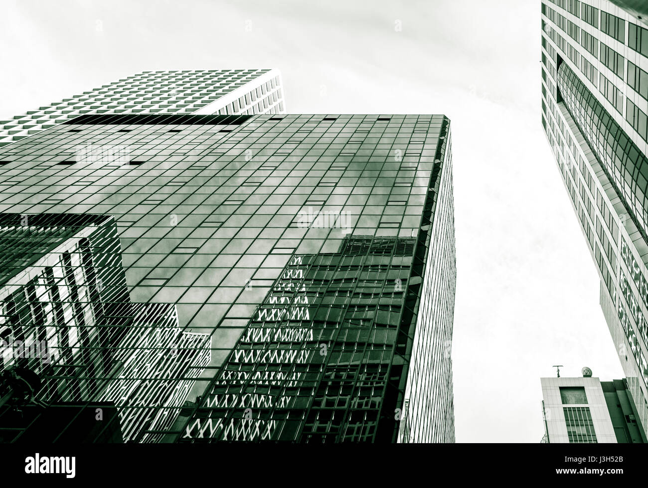 Modern office building detail, glass surface with green color Stock ...