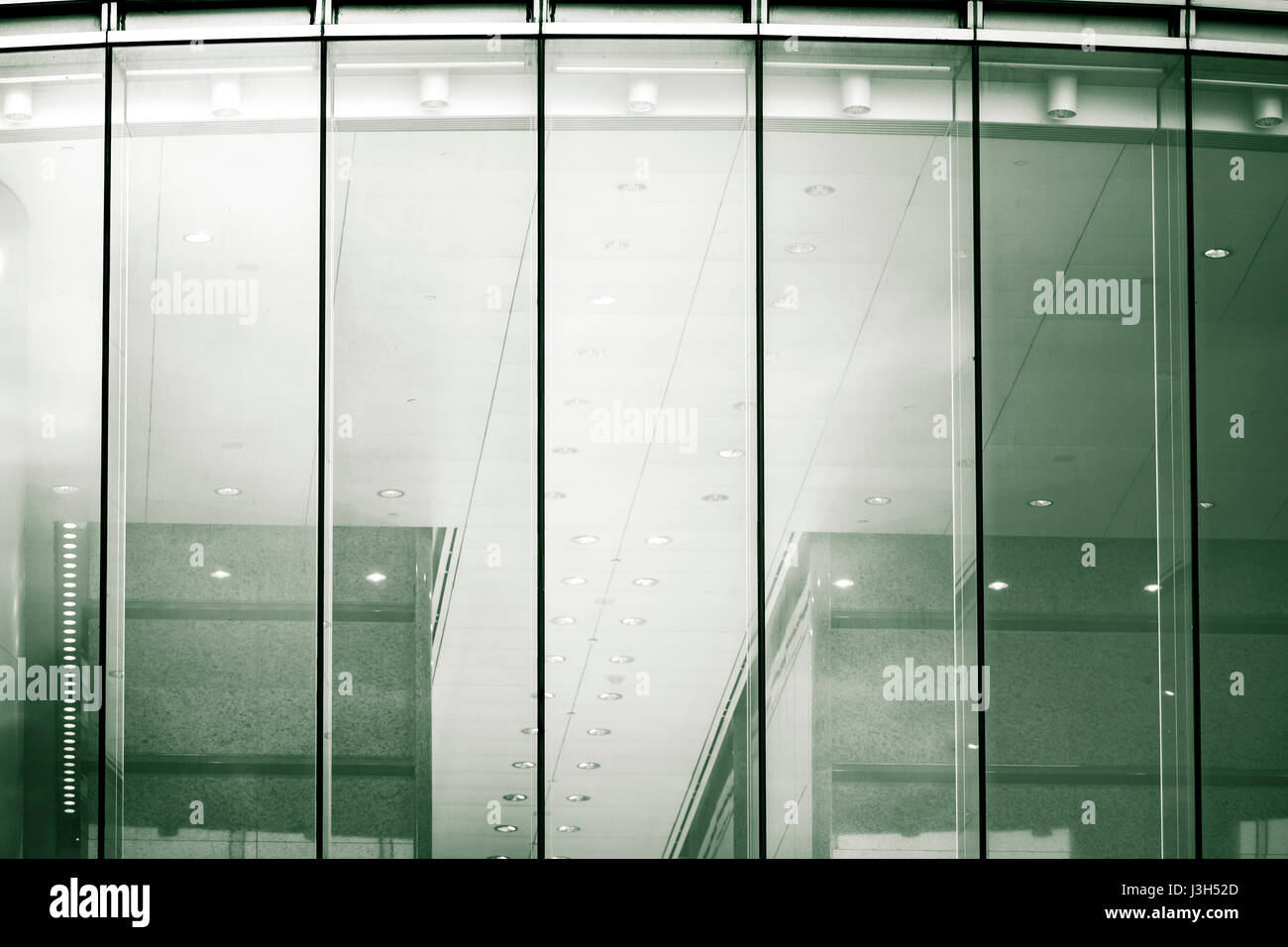 Modern office building detail, glass surface with green color Stock ...