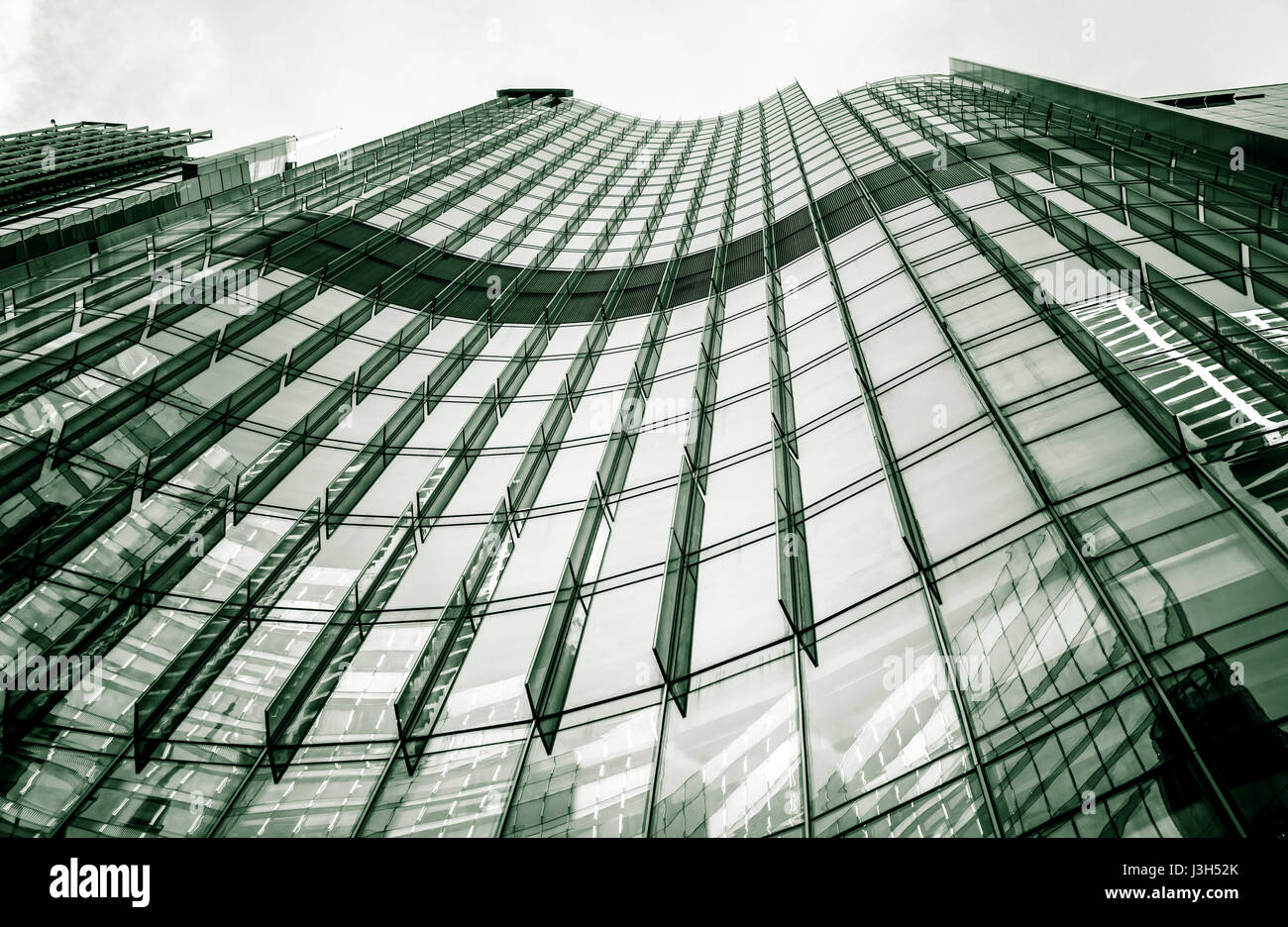Modern office building detail, glass surface with green color Stock ...