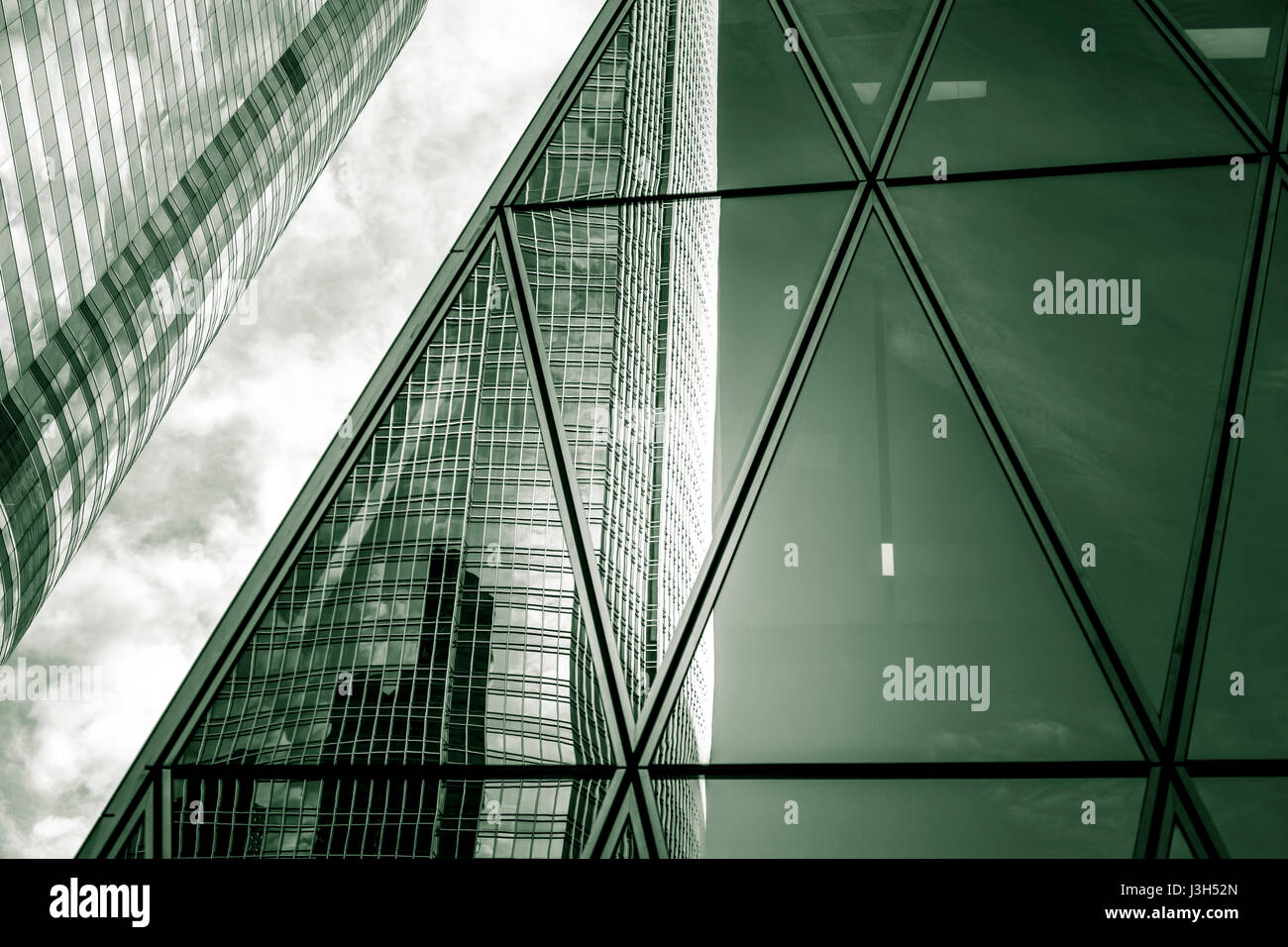 Modern office building detail, glass surface with green color Stock ...