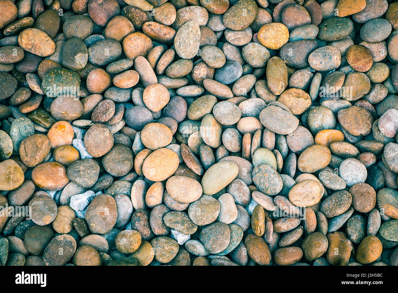 Sea stones background Stock Photo - Alamy