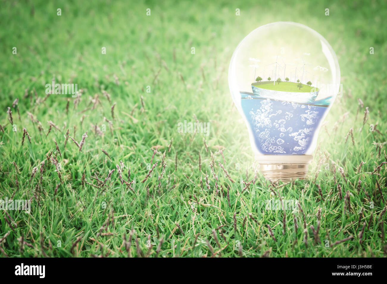 Smart phone with blank screen on green grass background Stock Photo - Alamy