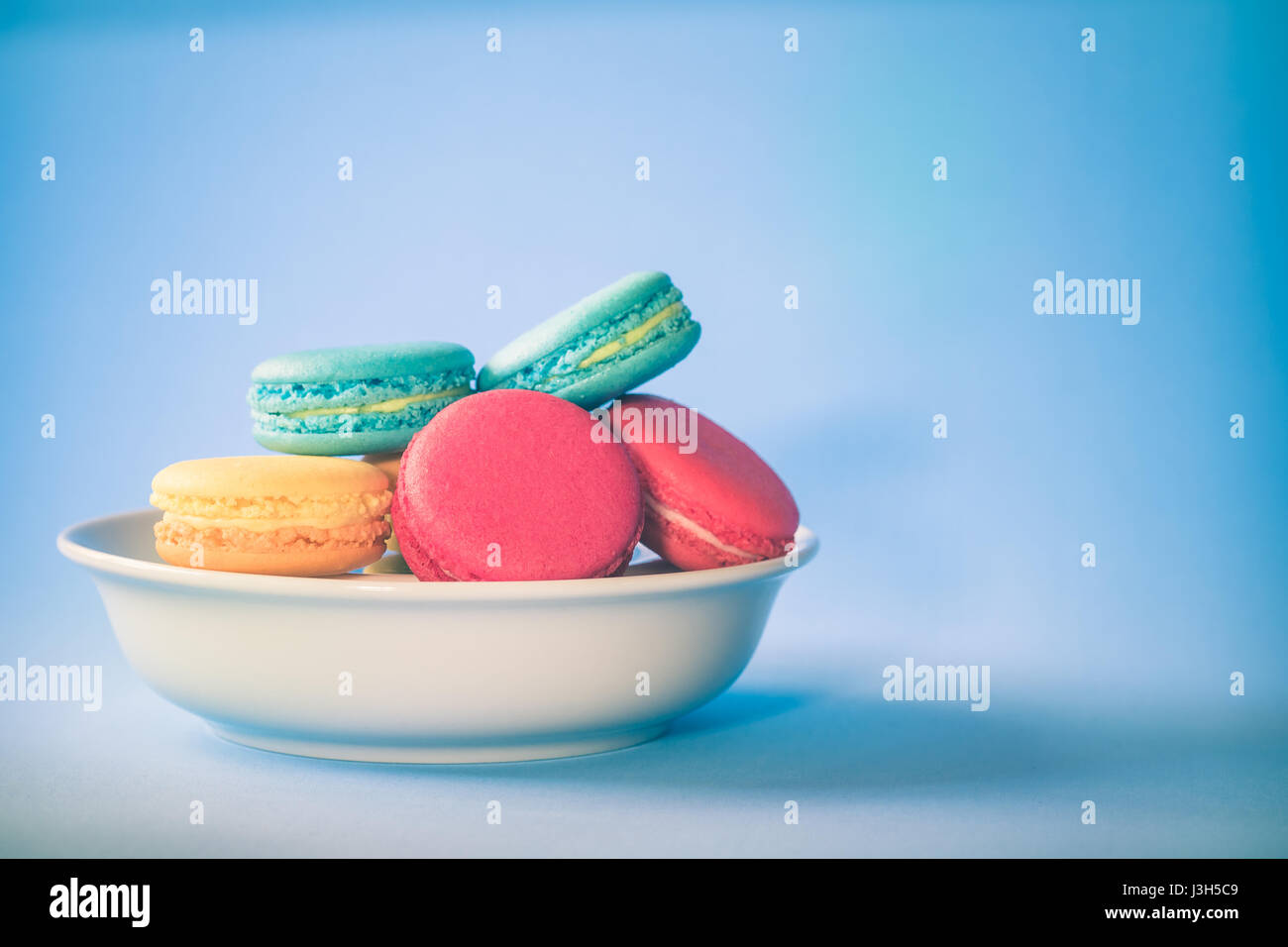 Assorted colorful french cookies macaroons, Almond cookies with pastel ...