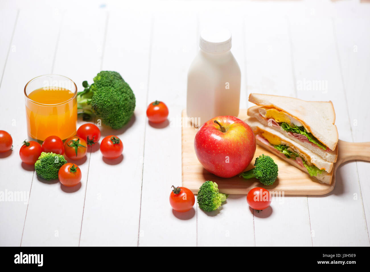 Lunch meal with milk, orange juice and sandwiches Stock Photo - Alamy