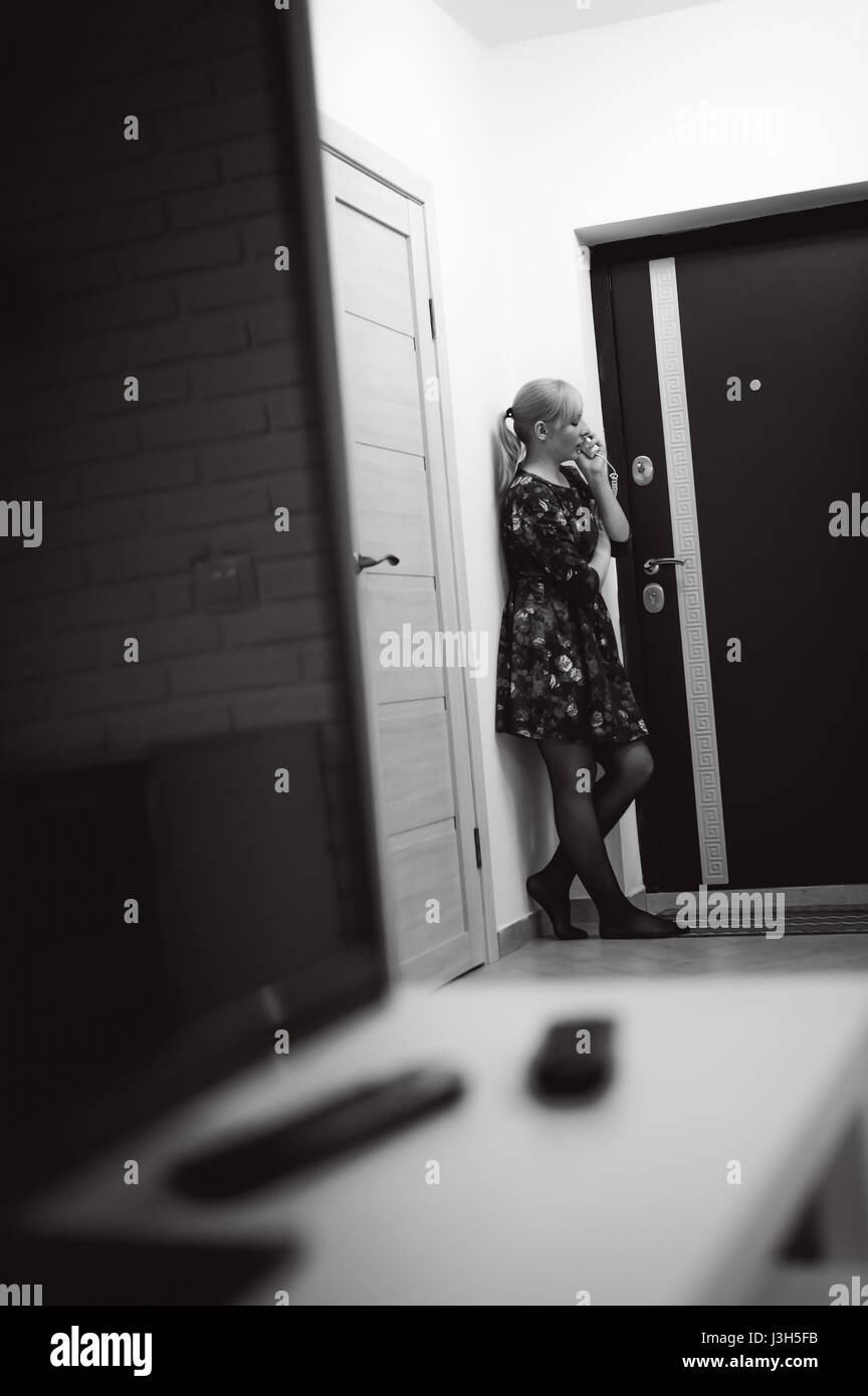 Woman answers door hi-res stock photography and images - Alamy