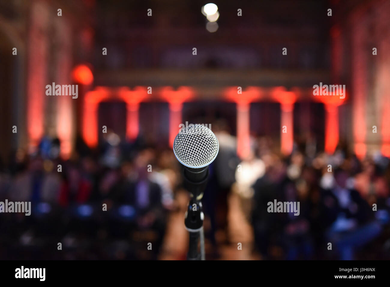 Microphone On Stage With Audience Event Experiences Lie In The