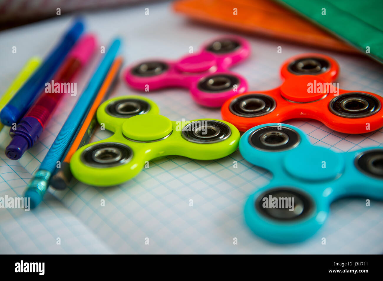 A fidget spinner toy in a school setting Stock Photo - Alamy