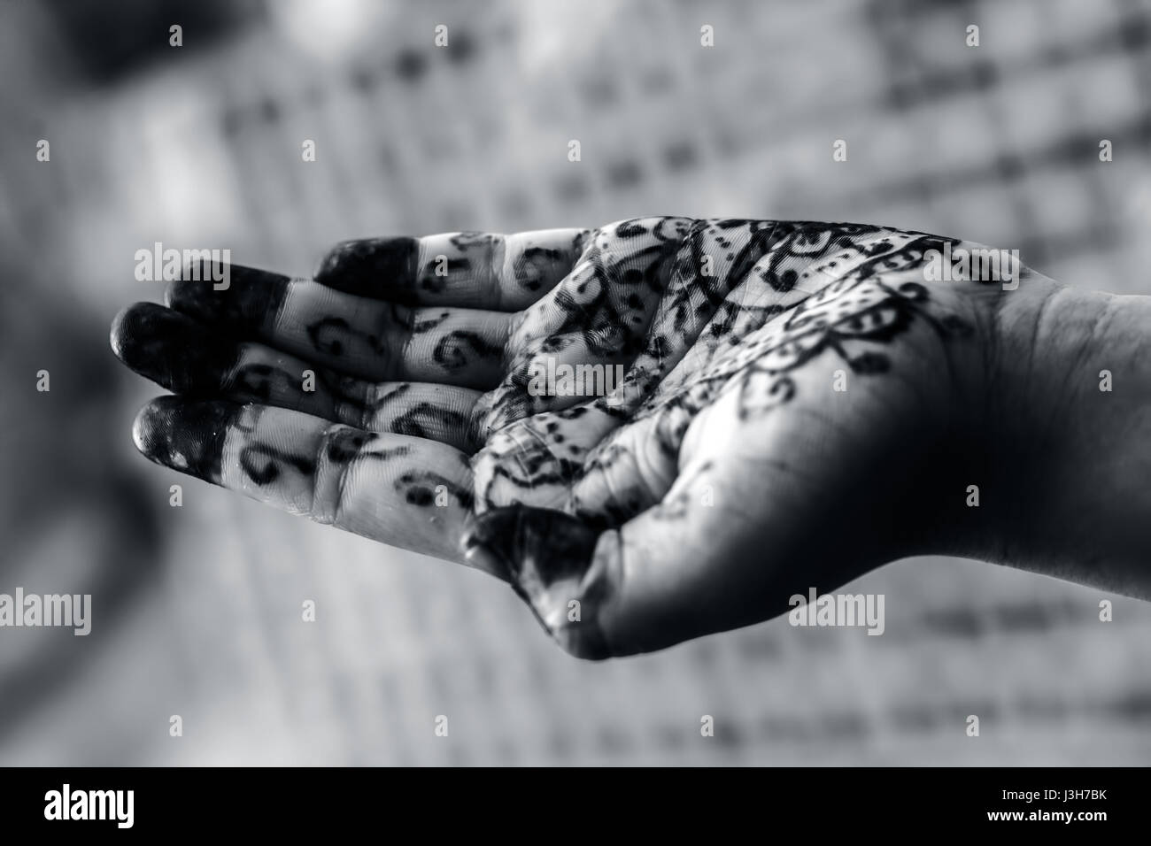 A girl showing his hand decorated with ;Hanna' Stock Photo - Alamy