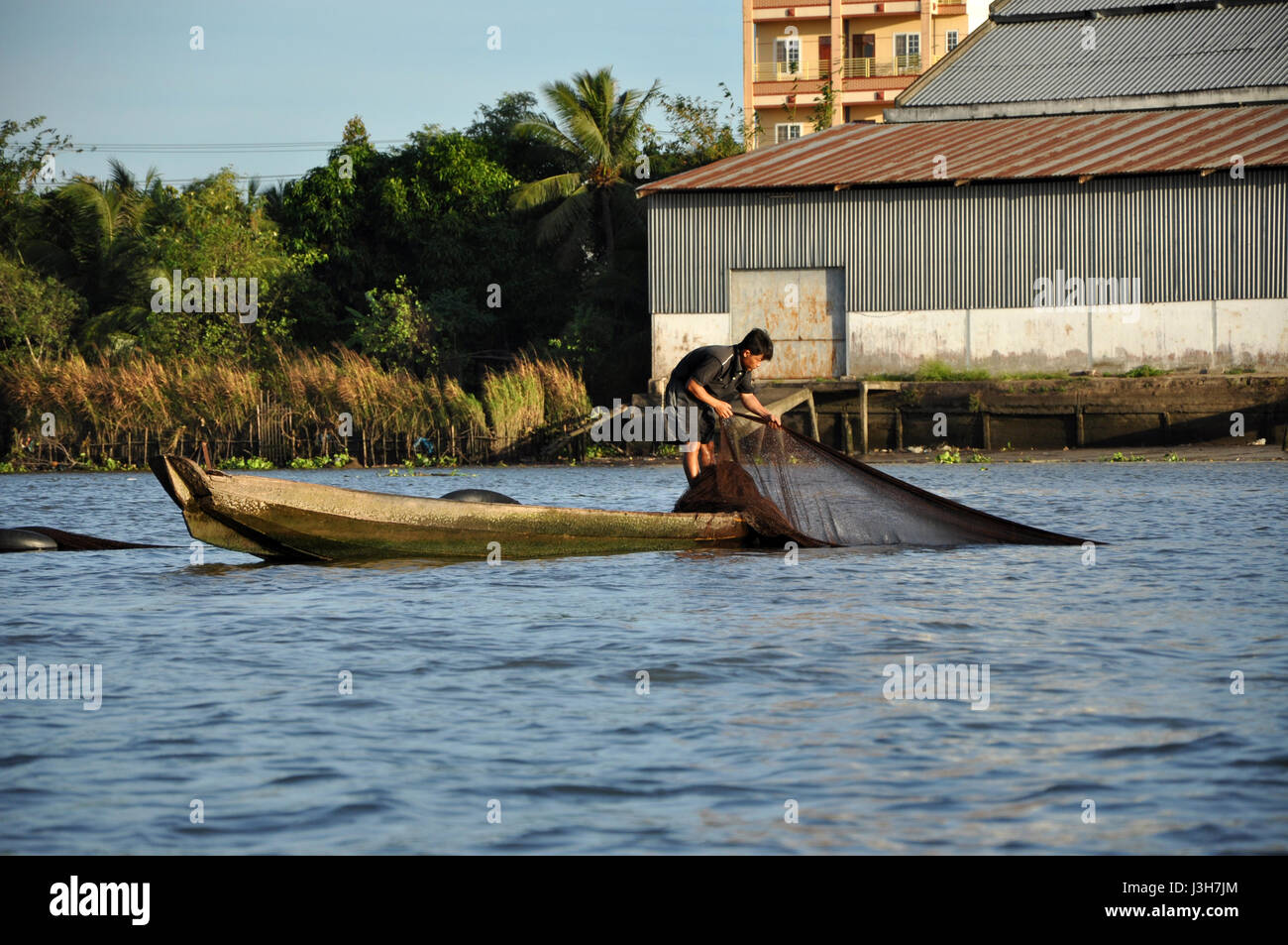 CAN THO, VIETNAM - FEBRUARY 17, 2013: Fisherman fishing with fishing ...