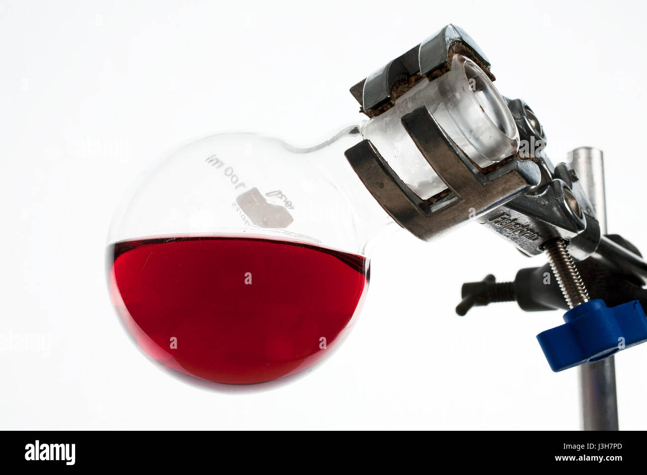Chemistry glassware with colored liquid Stock Photo - Alamy