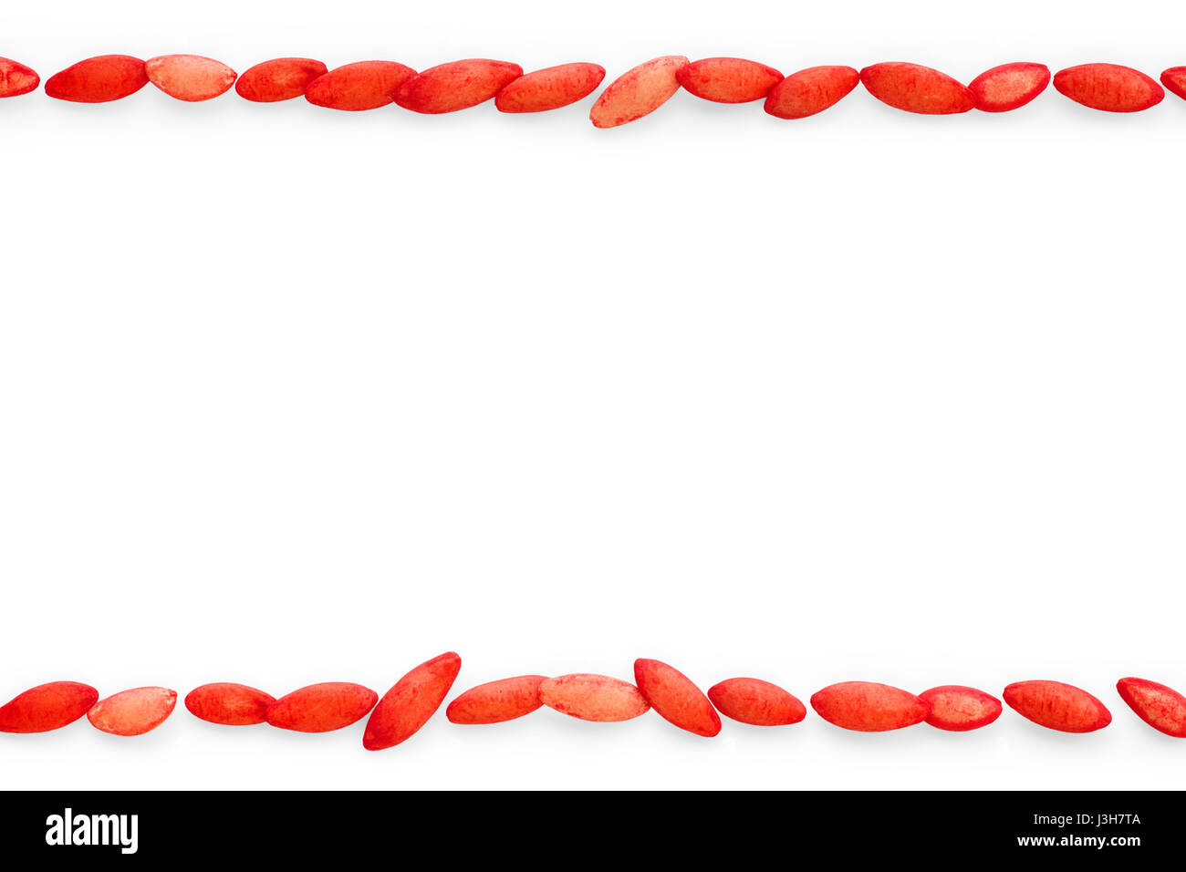 Red cucumber seeds as frame. Isolated on white background Stock Photo ...