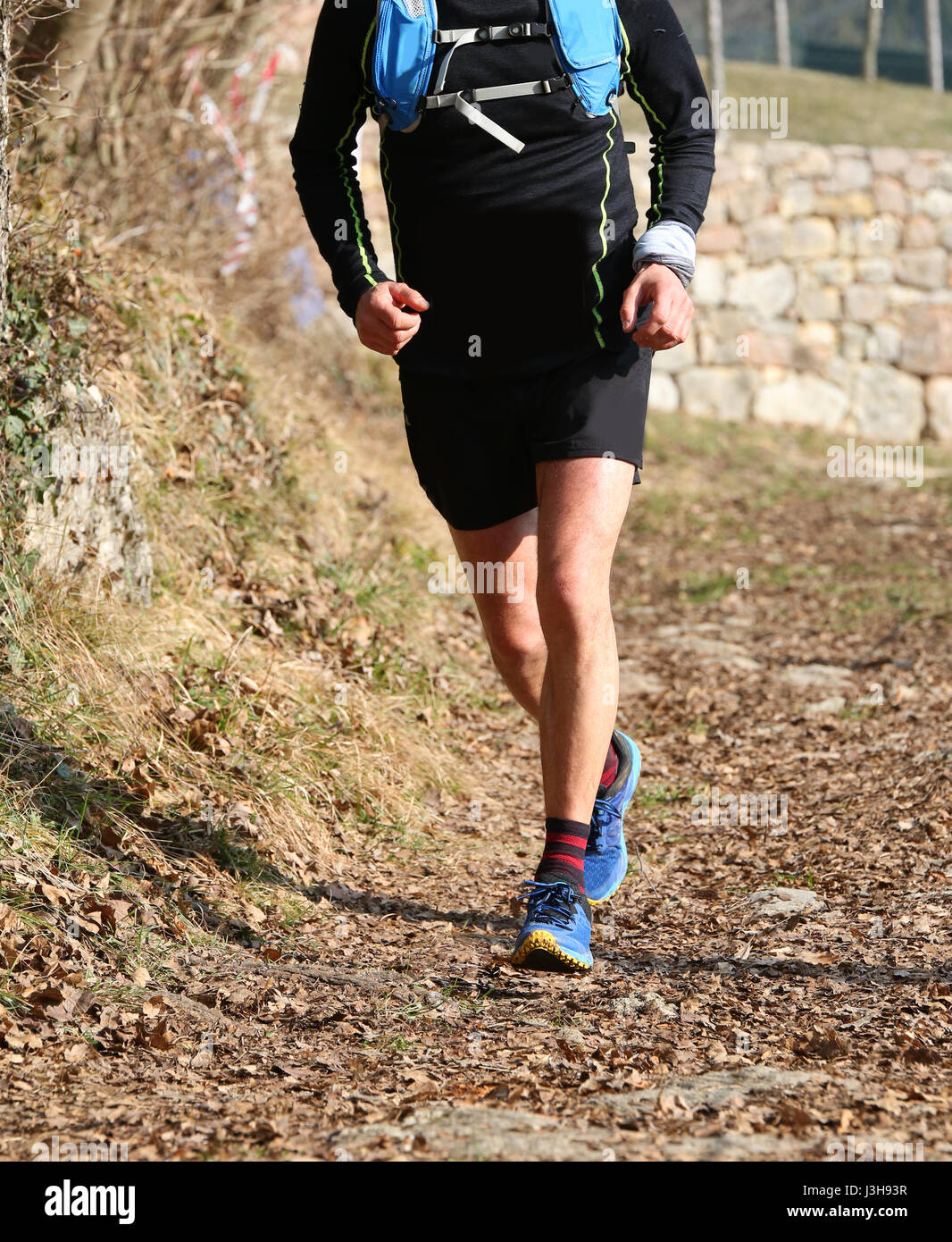 man running during a cross country race Stock Photo - Alamy