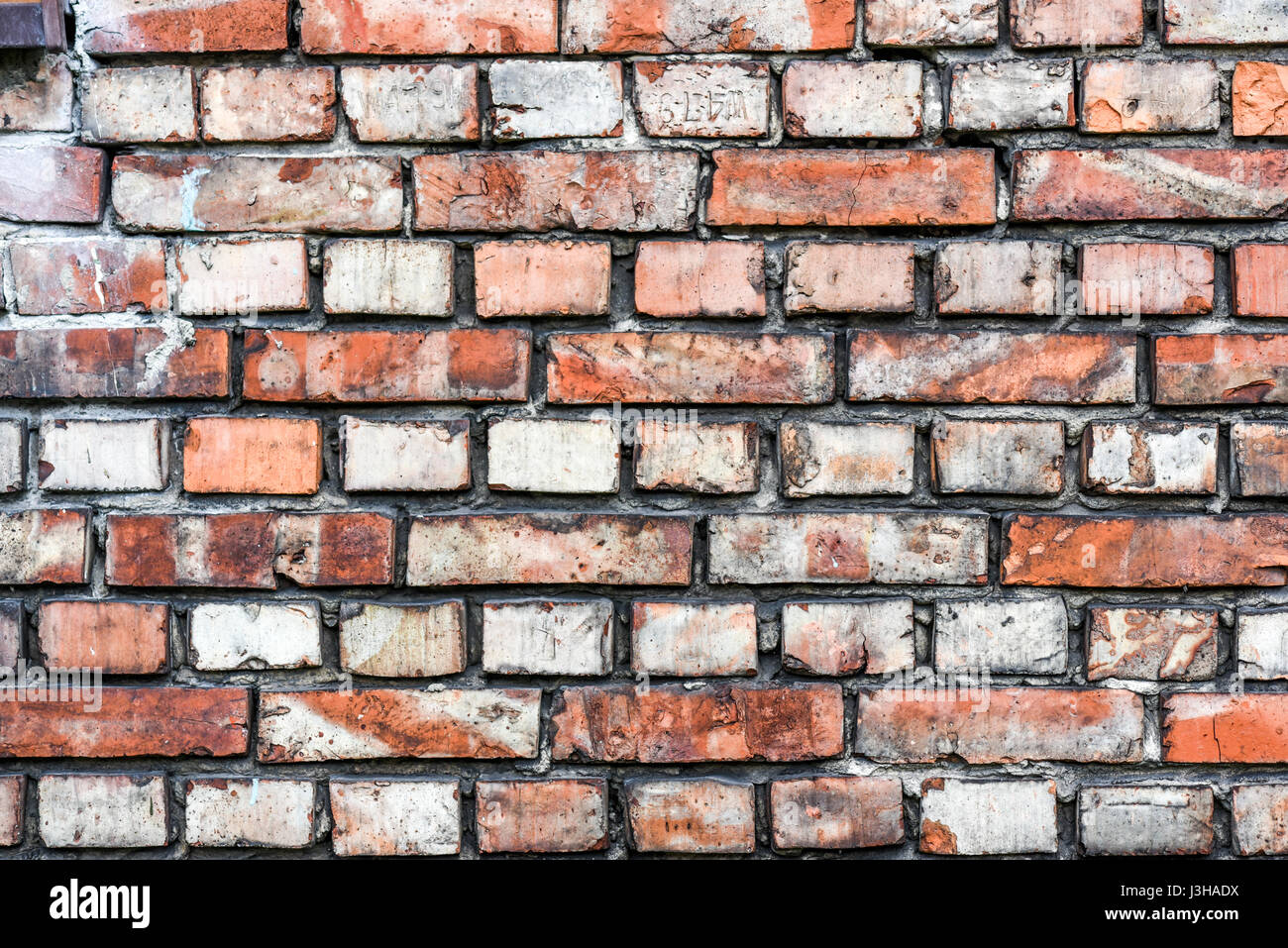 Colorful irregular brick wall texture or background Stock Photo - Alamy