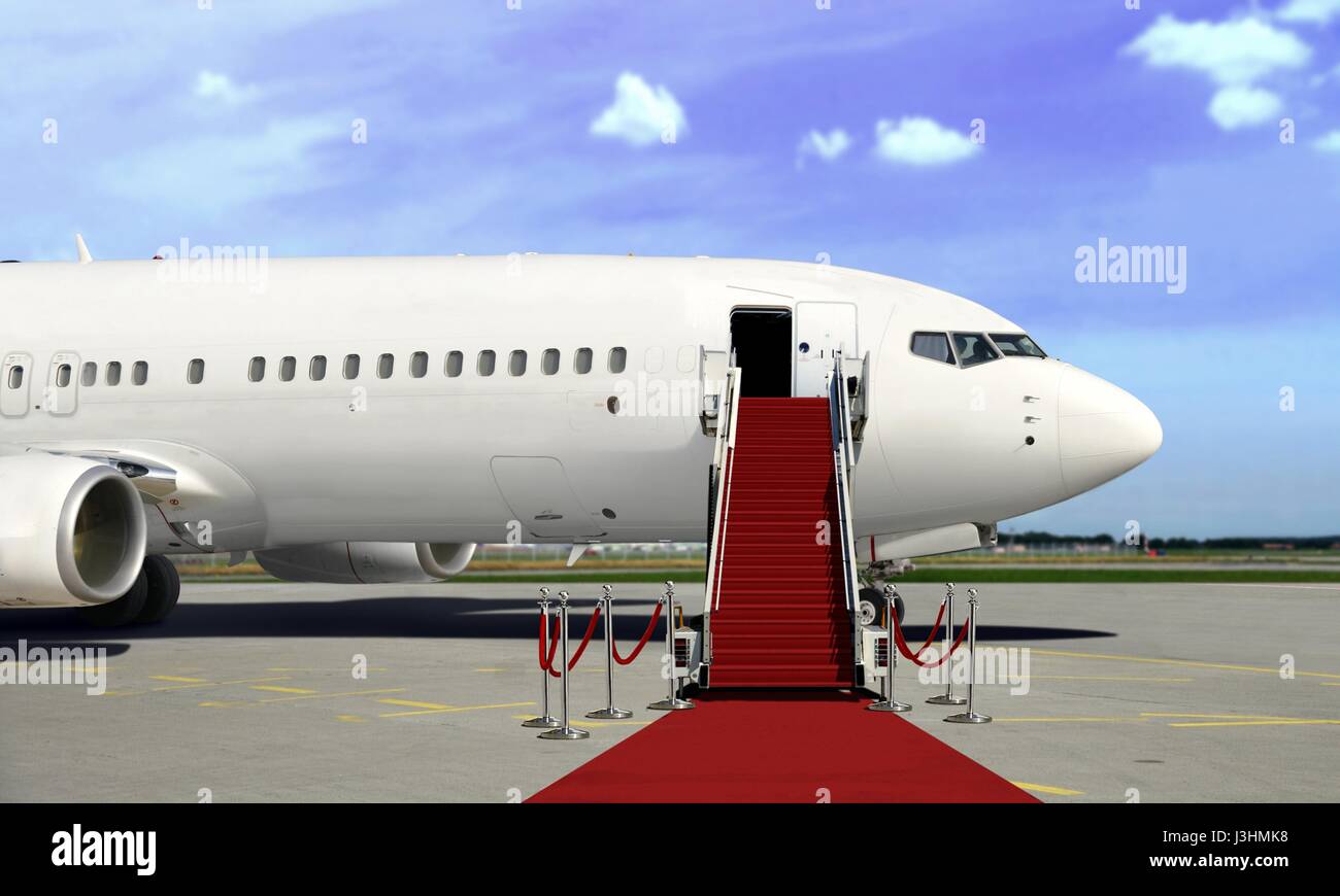Boarding commercial airplane with red carpet presentation Stock Photo ...