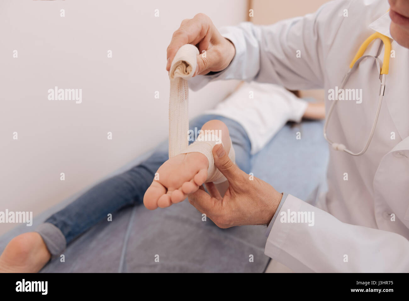 White band. Qualified trained excellent doctor using special medical ...