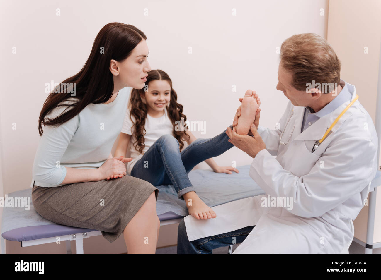 Clear explanation. Nice accomplished local rheumatologist examining ...