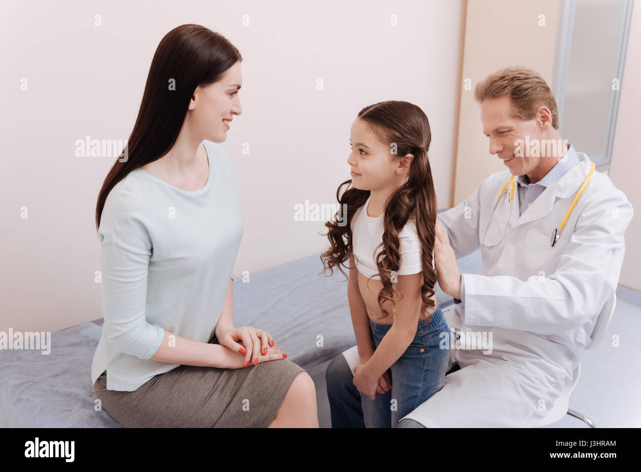 Checking posture. Sweet young pretty ladies paying specialist a visit ...