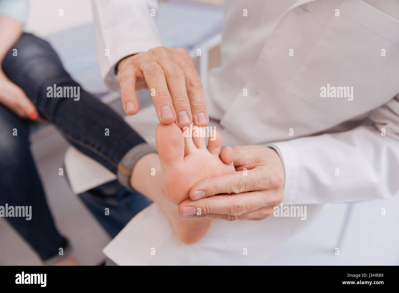 Testing reflexes. Delicate dedicated wonderful expert trying not ...