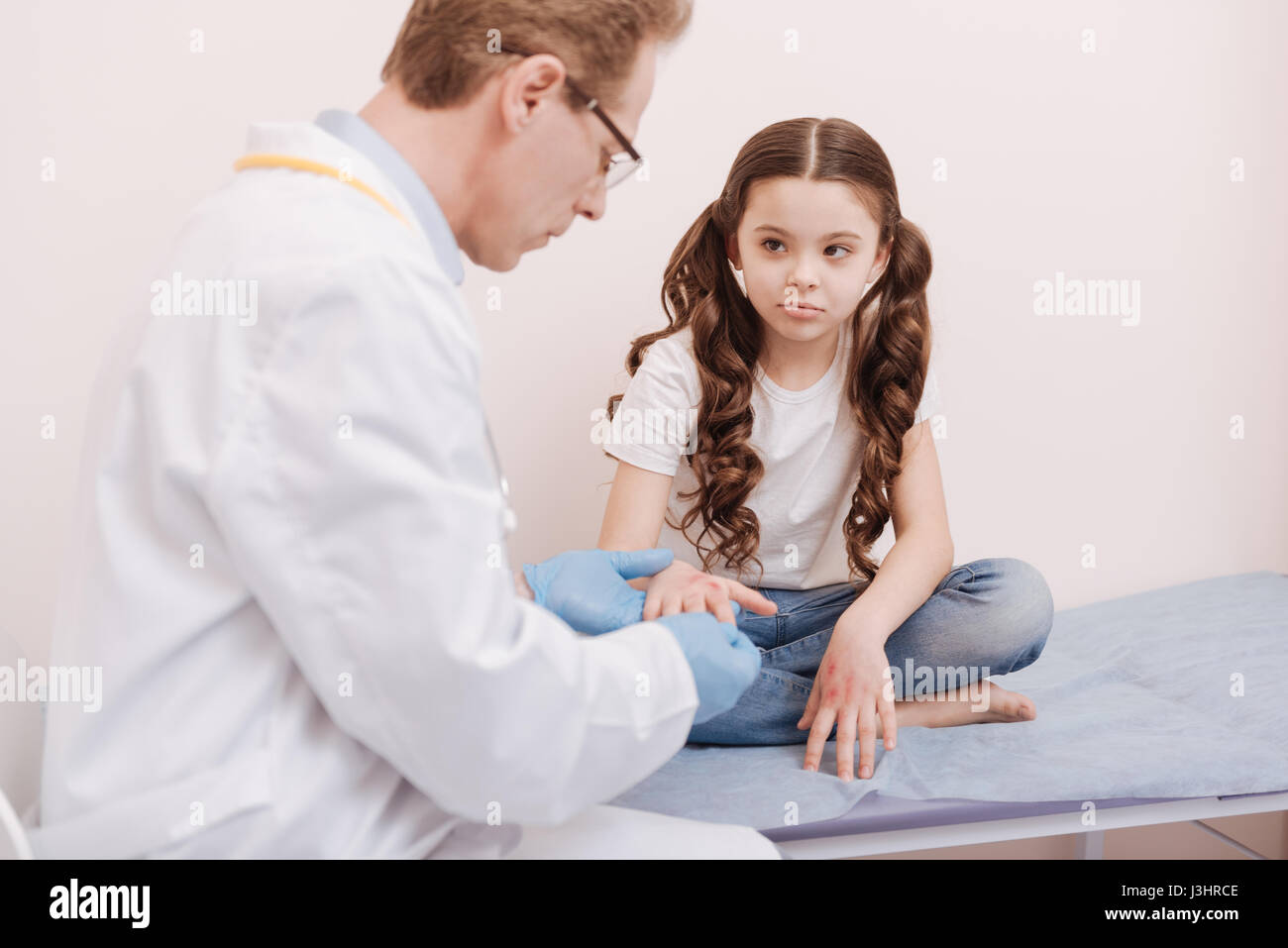 Experts opinion. Concerned nice attractive girl showing an expert the ...