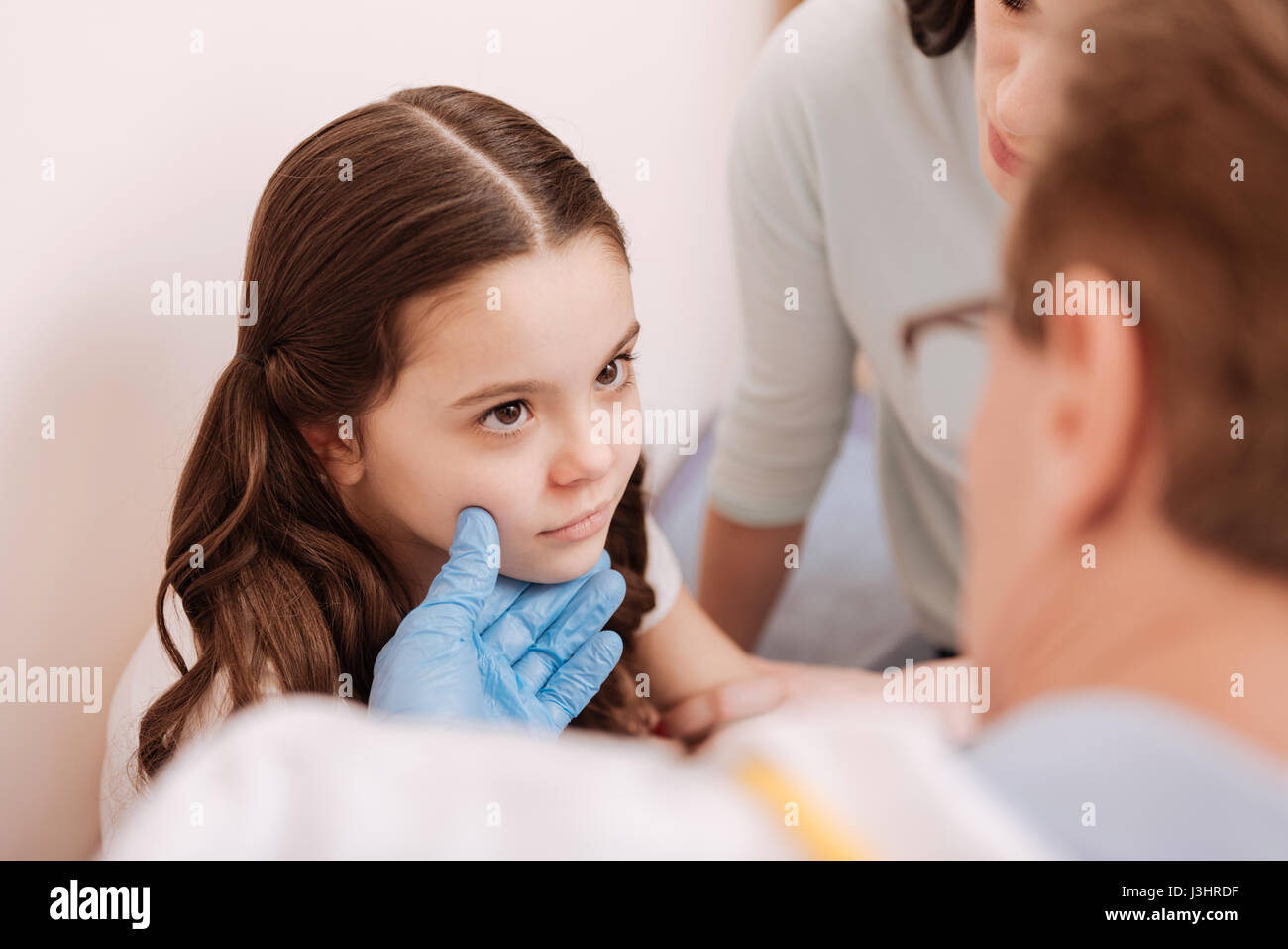 Skin reaction. Hardworking successful competent doctor making sure the ...