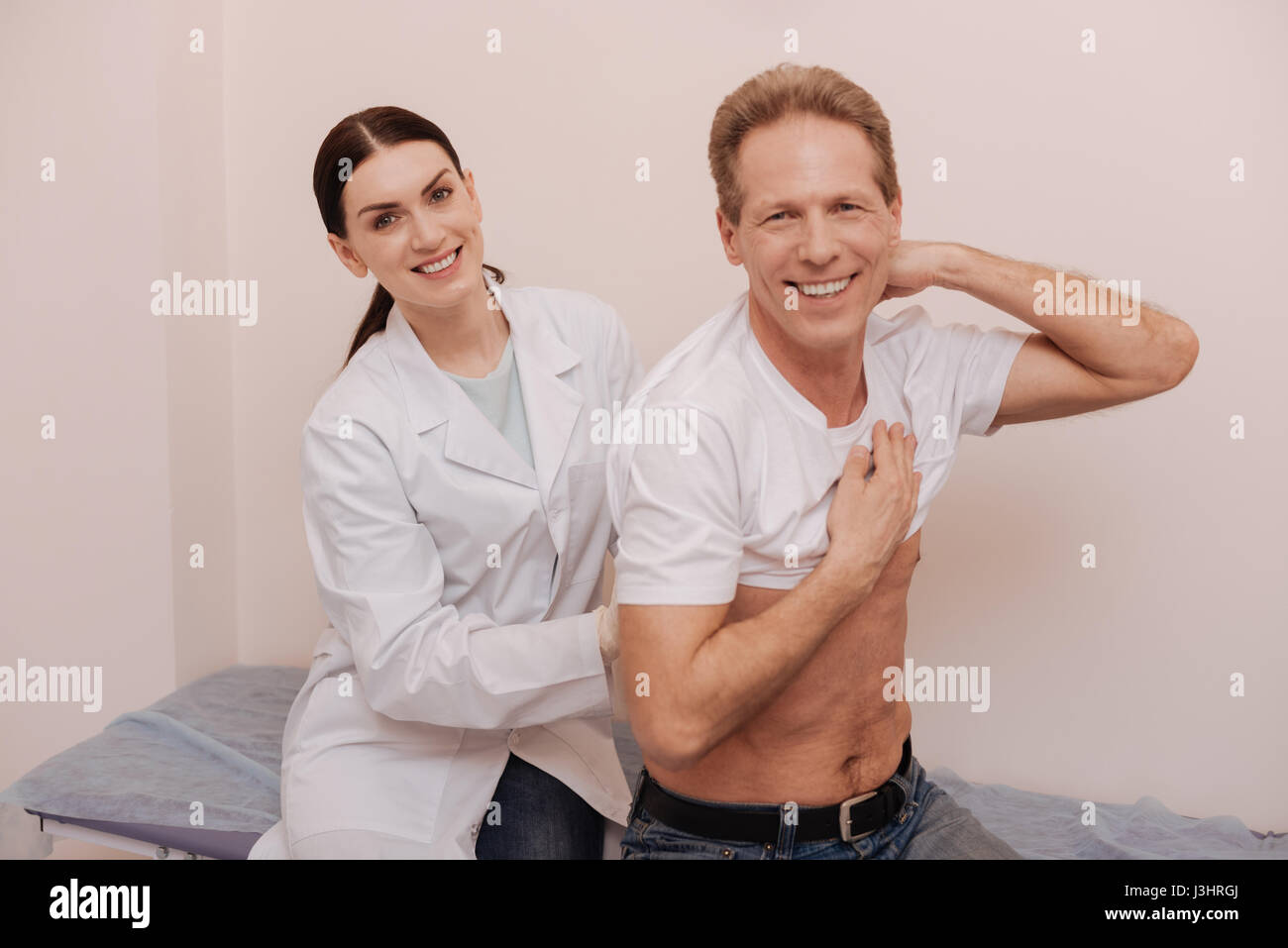 Making people feeling better. Fit good looking enthusiastic man having ...