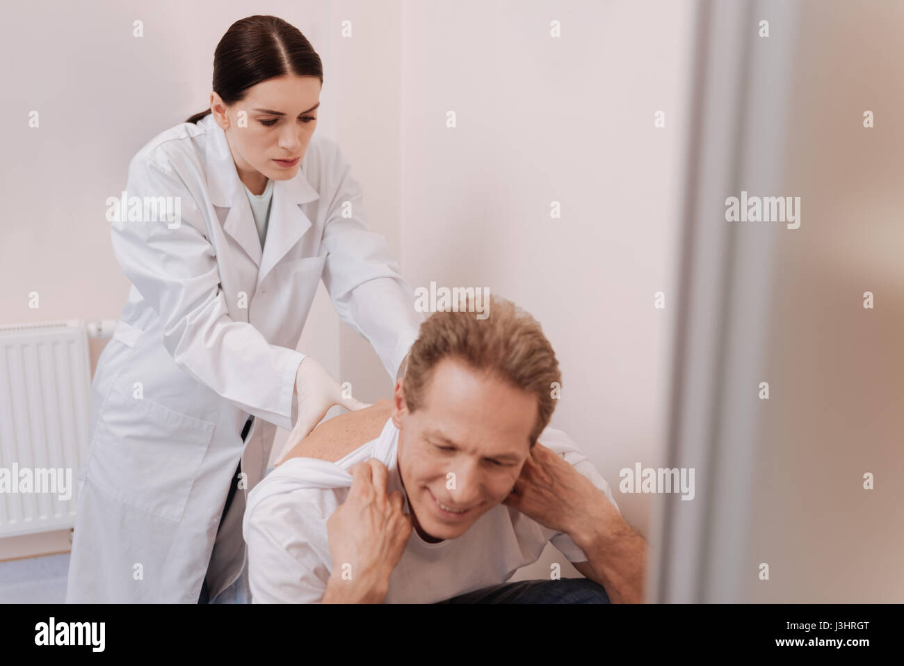 The focus of the problem. Young smart qualified rheumatologist using ...
